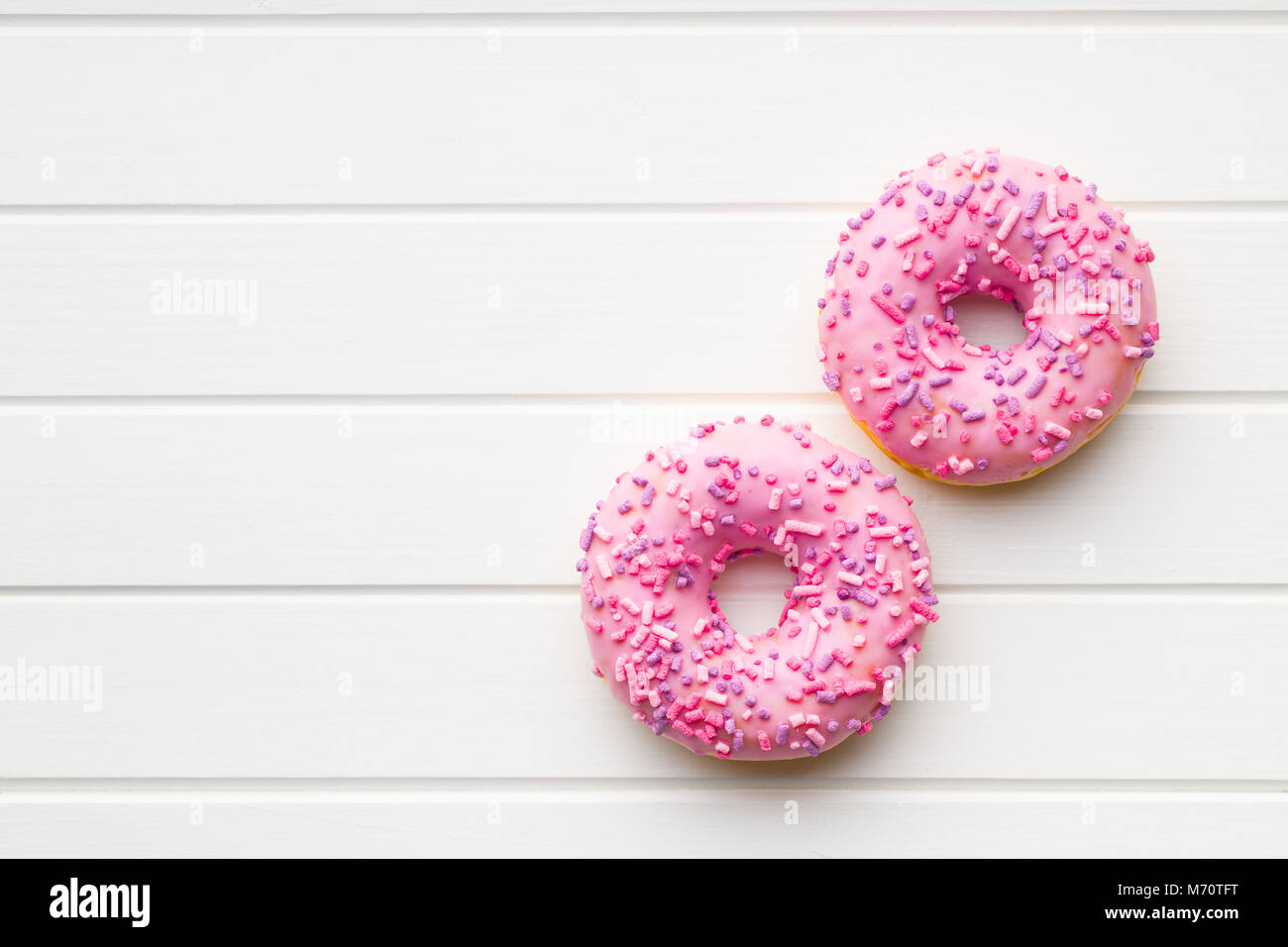 Two pink glazed donut hi-res stock photography and images - Alamy