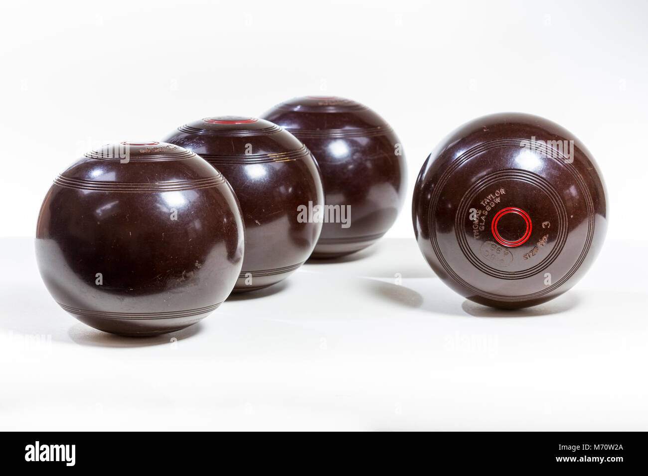 Set of four lawn bowls bowls Stock Photo - Alamy