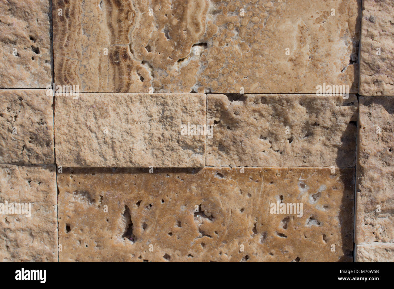 Decorative cubic stone wall as background texture Stock Photo - Alamy