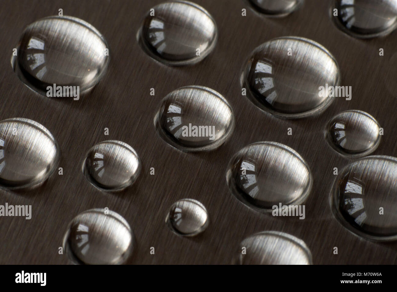 Drops of water on metal. Closeup. Beautiful texture and gray background ...