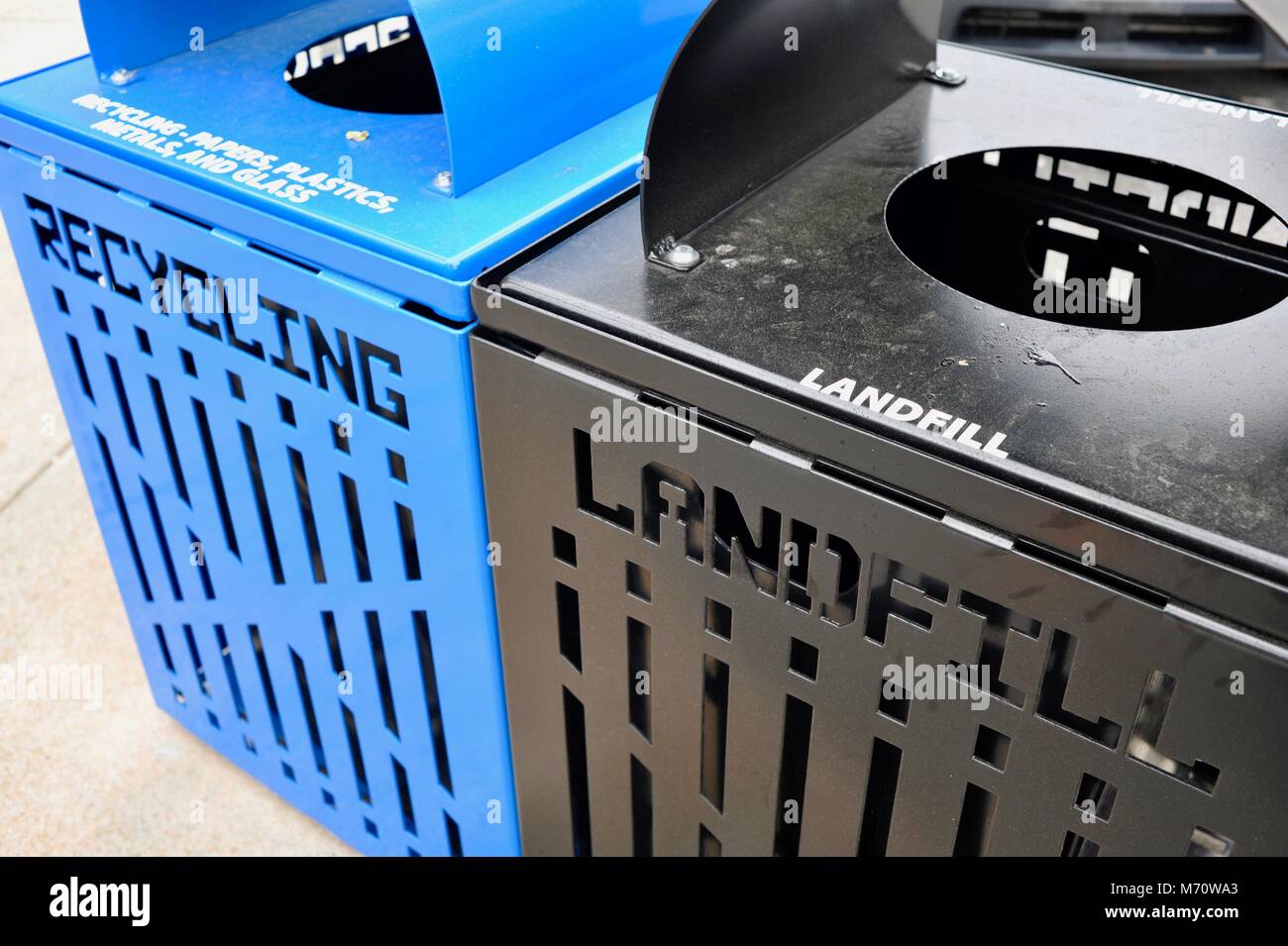 Recycling bin container next to trash bin labeled "Landfill" in USA ...