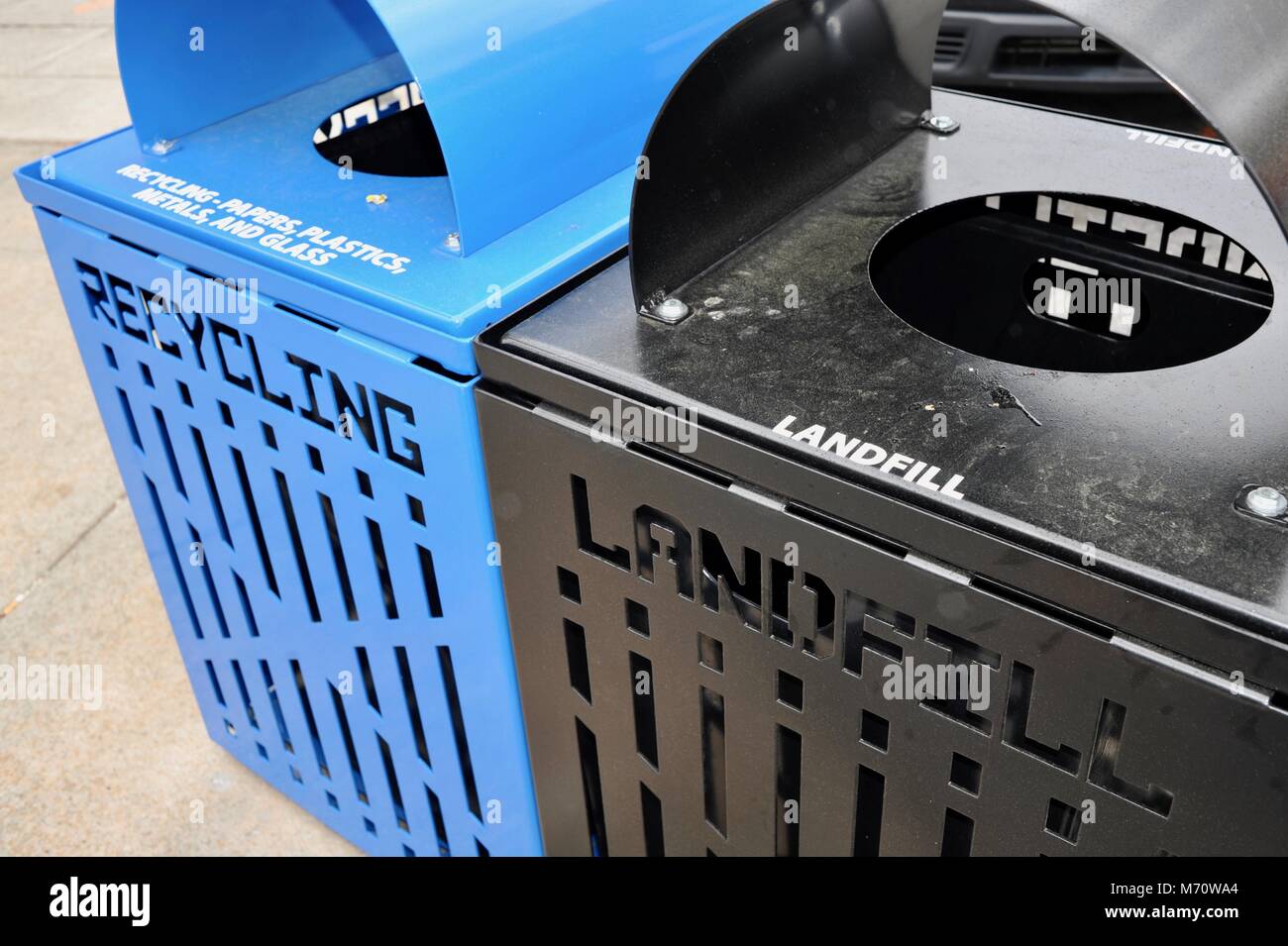 Recycling bin container next to trash bin labeled "Landfill" in USA ...