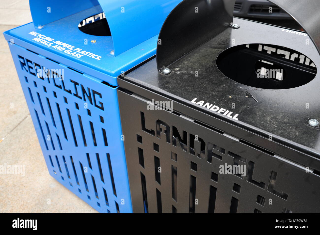 Recycling bin container next to trash bin labeled "Landfill" in USA ...