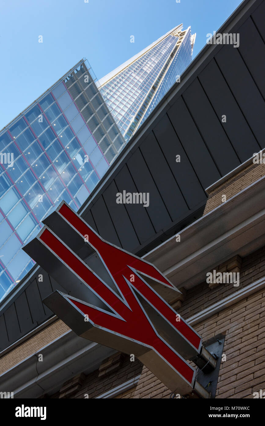 the double arrow railway or train station red sign of network rail or ...