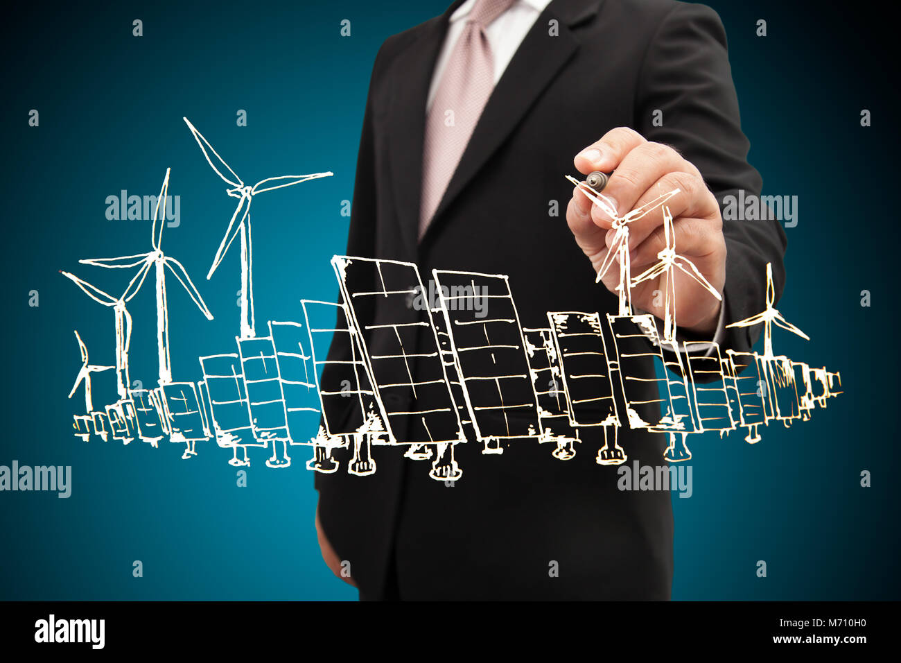 Businessman drawing renewable energy project Stock Photo - Alamy