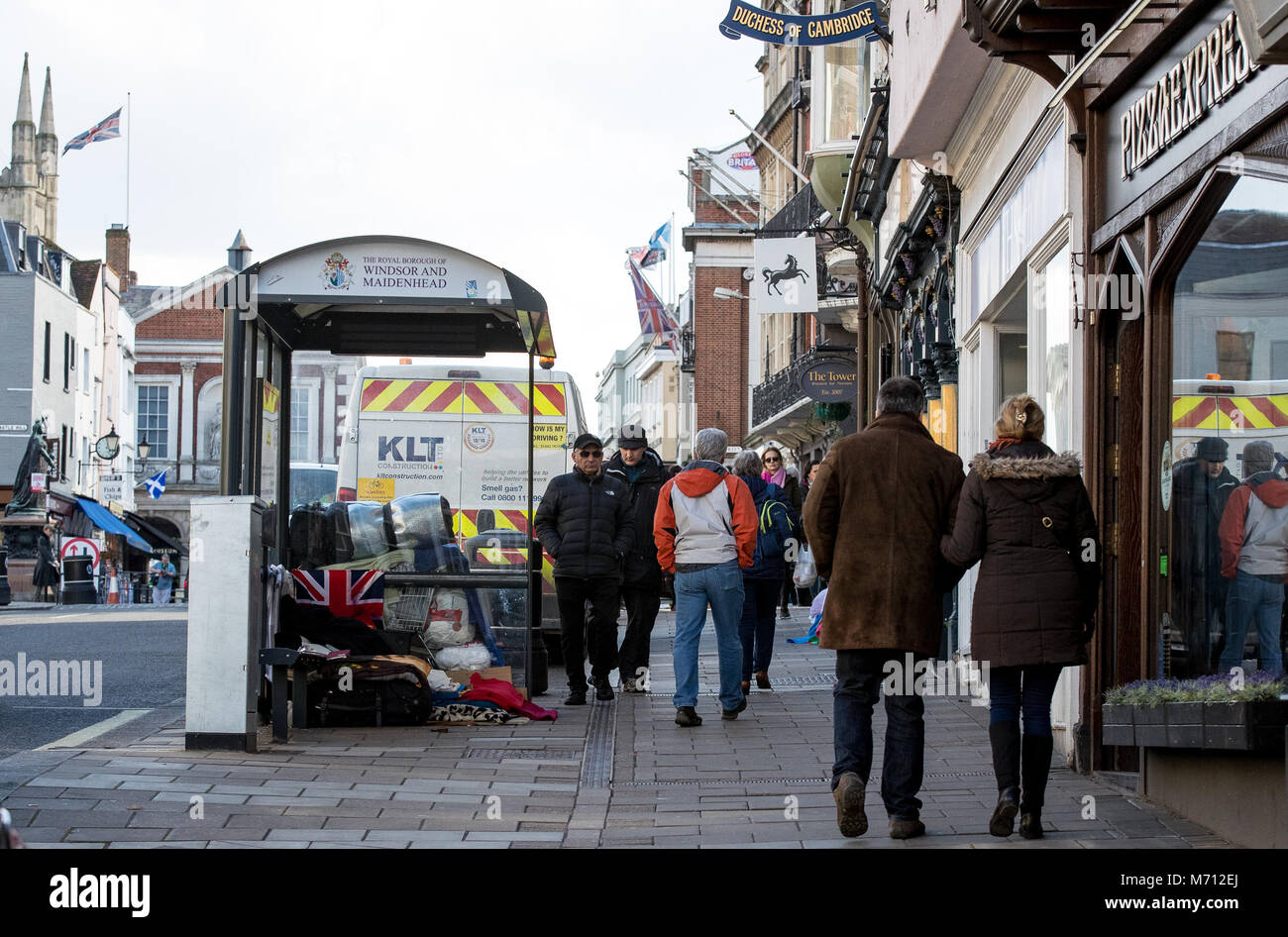 Windsor, UK. A Bus shelter is filled with possessions of homeless who ...