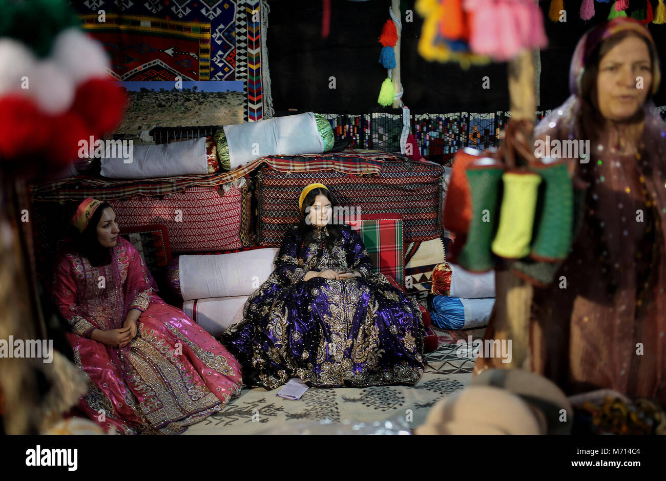 Tehran, Iran. 7th Mar, 2018. Iranian nomads wearing local costumes are ...