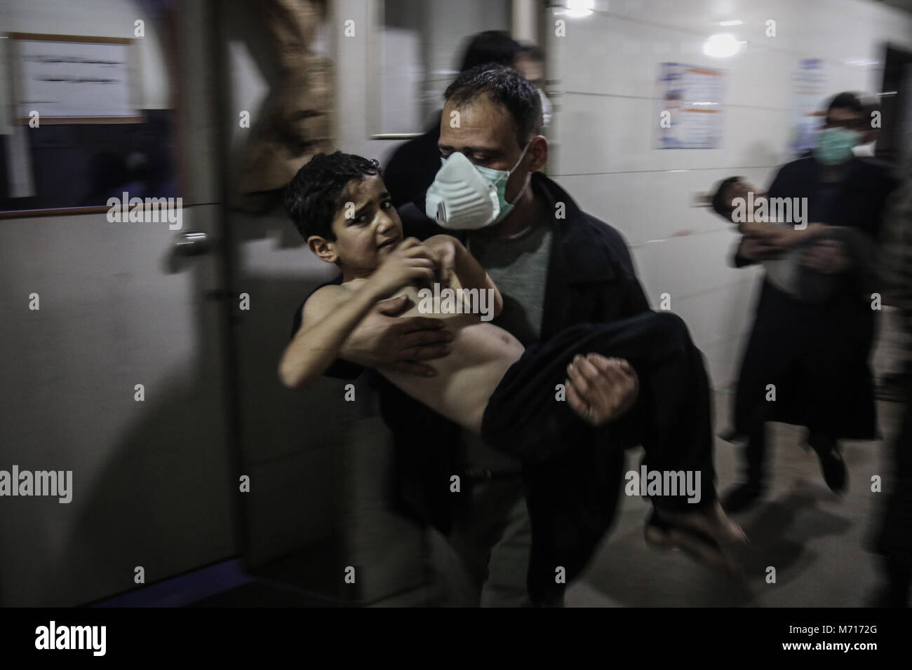 Syrian children are rushed to a hospital after what local sources say ...