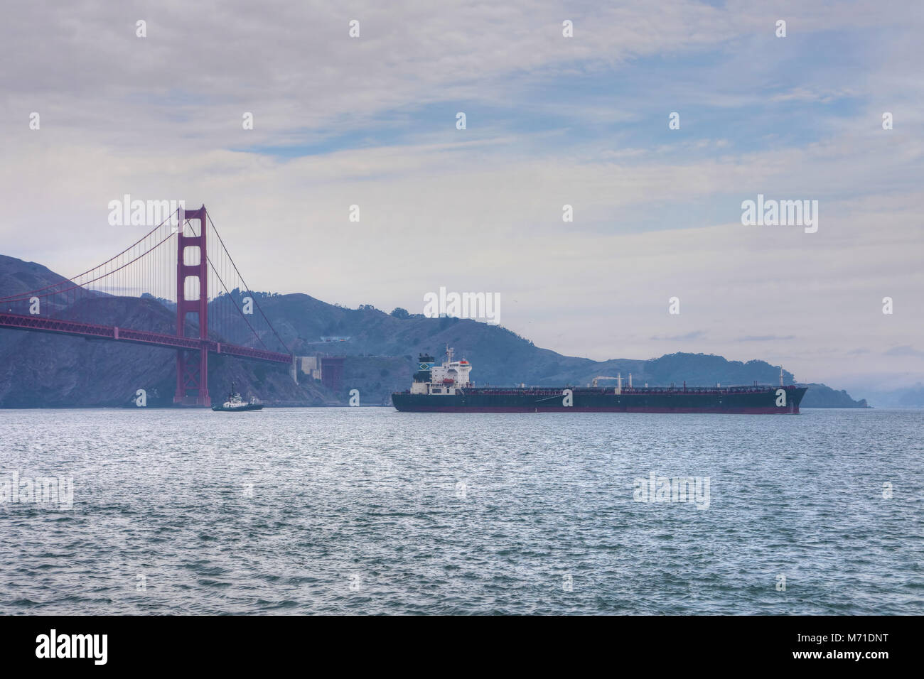A Freighter passing the Golden Gate Bridge Stock Photo - Alamy