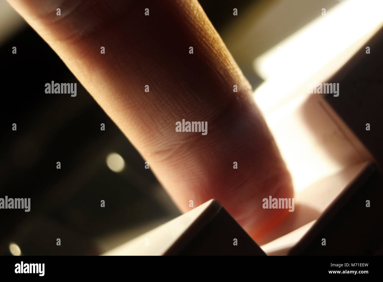 Close-up of finger pressing key piano keyboard Stock Photo - Alamy