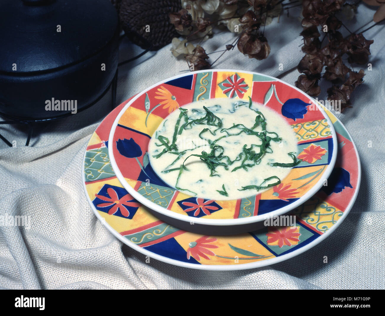Plate of soup with cream Stock Photo - Alamy