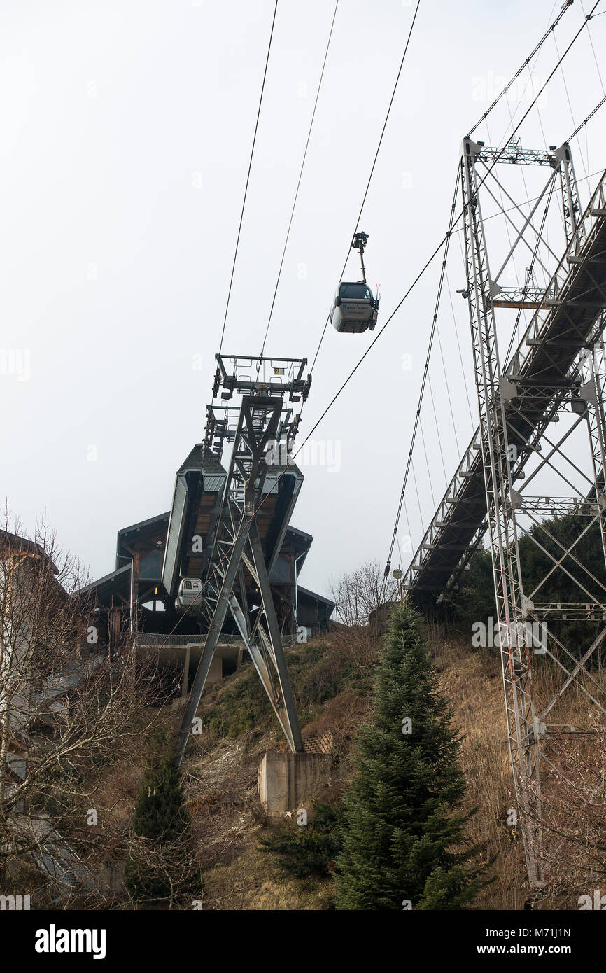 A Gondola Running Alongside a Suspension Bridge Walkway in the Ski ...