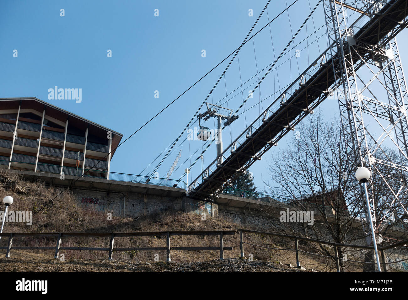 A Gondola Running Alongside a Suspension Bridge Walkway in the Ski ...