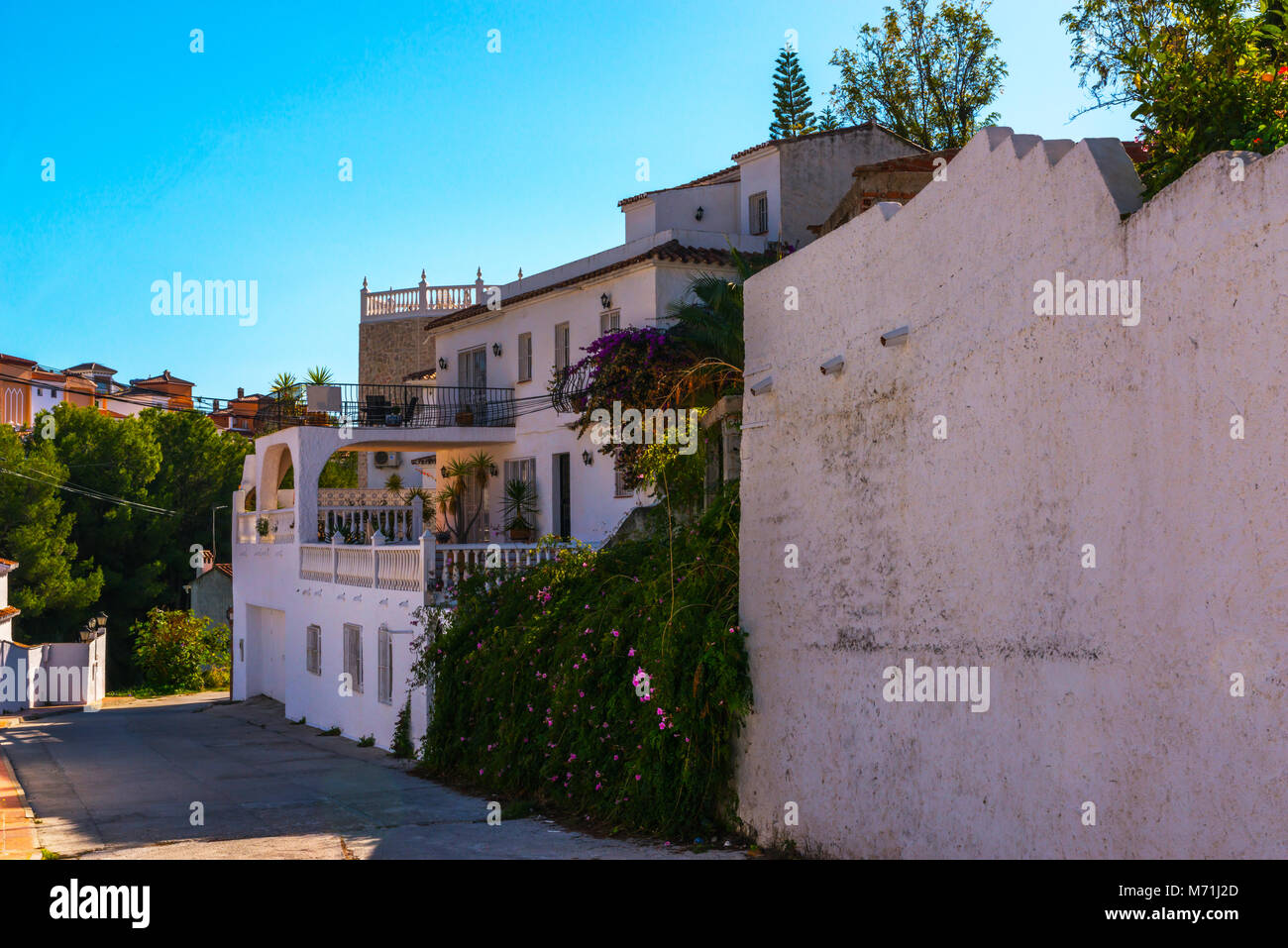 beautiful, picturesque street, narrow road, white facades of buildings ...