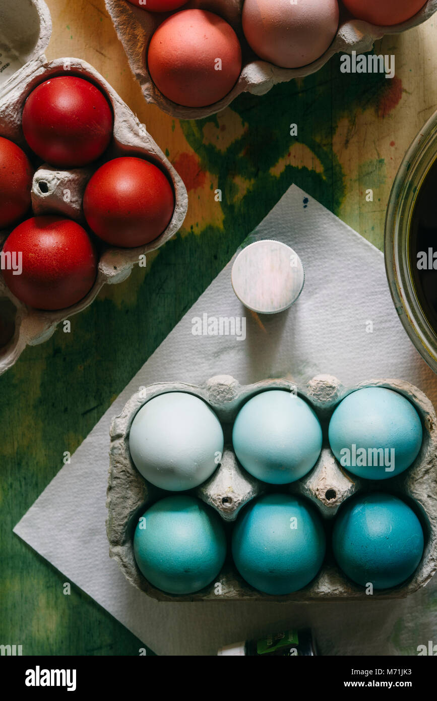 Dyeing eggs for Easter holidays, colored eggs with blue tint and ...