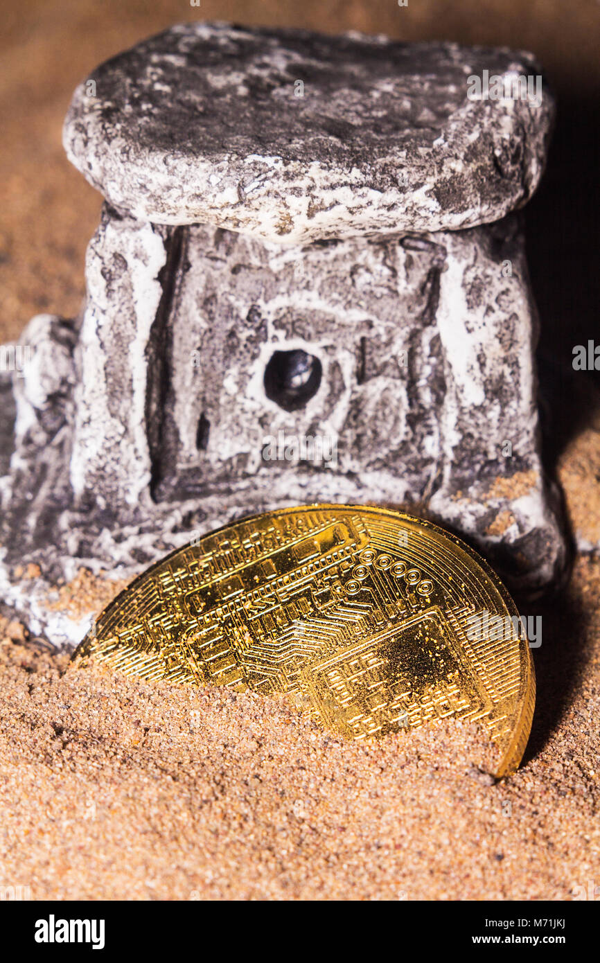 Crypto currency bitcoin in the sand near the ancient temple Stock Photo ...