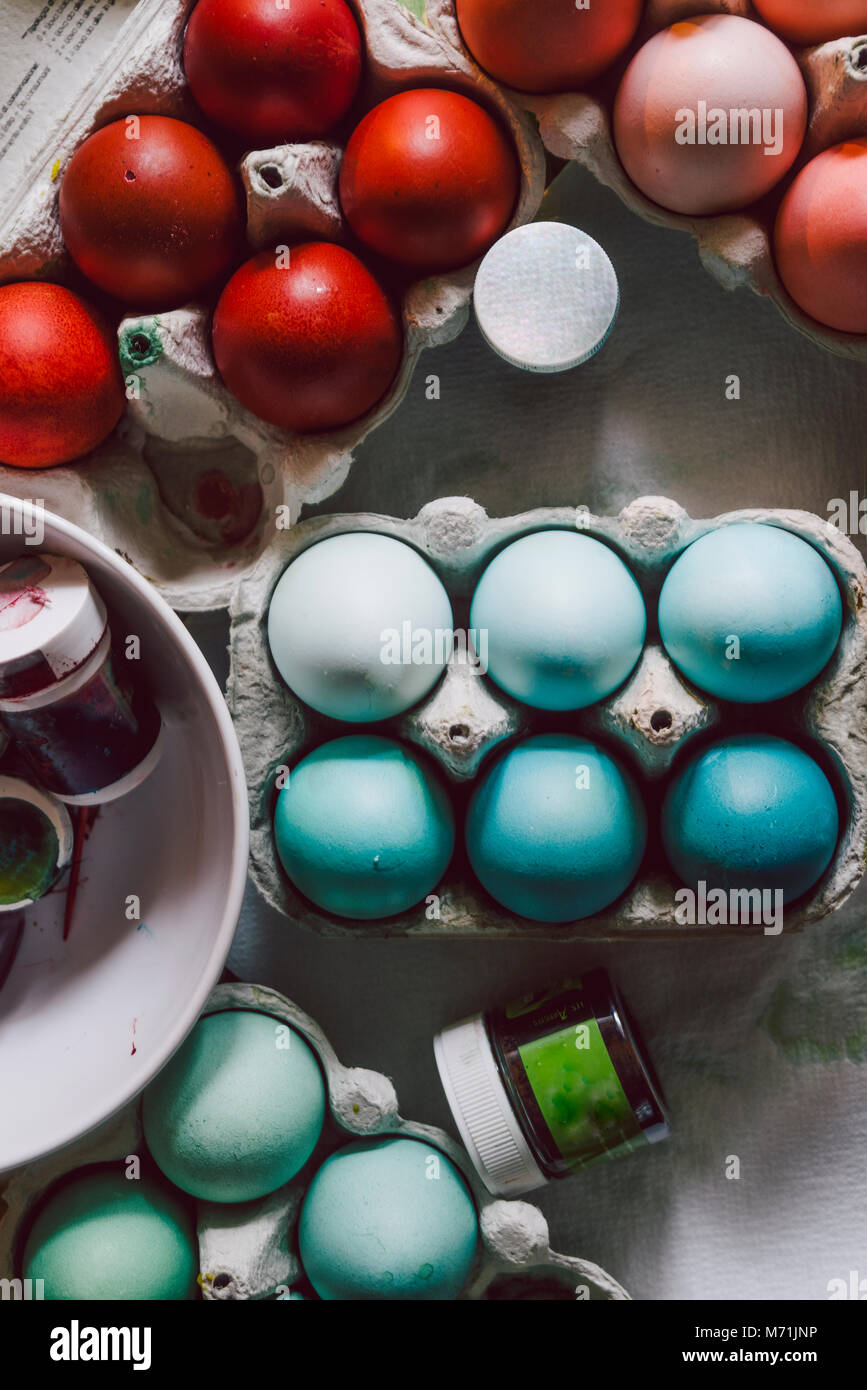 Dyeing eggs for Easter holidays, colored eggs with blue tint and ...