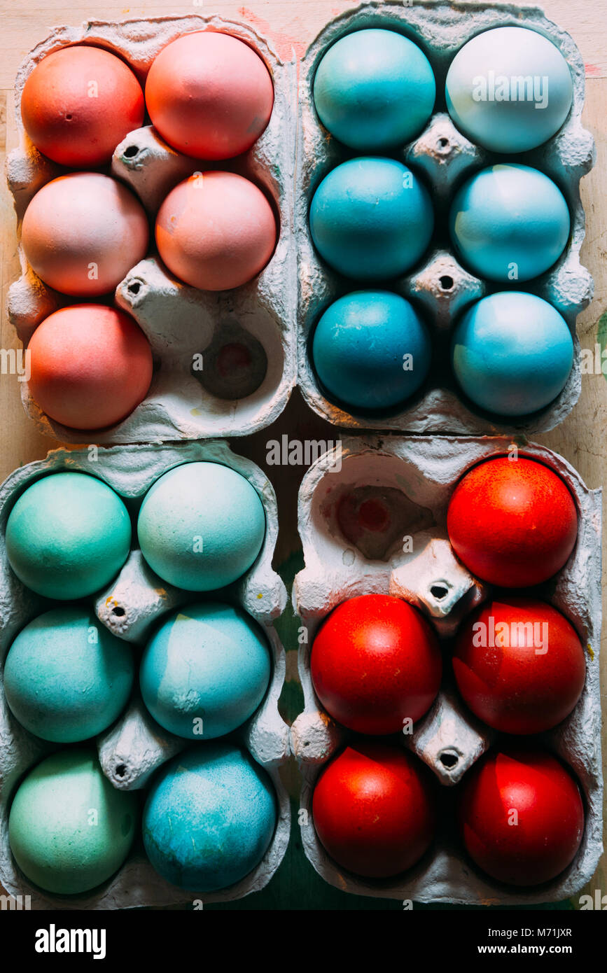Dyeing eggs for Easter holidays, colored eggs with blue tint and ...