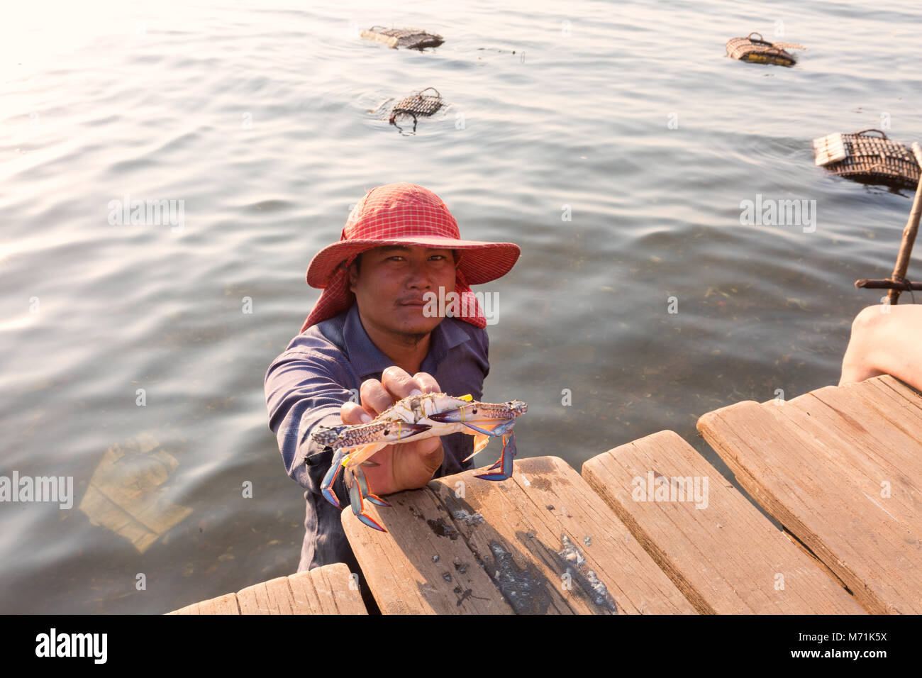 Crab fisherman showing a crabs, Kep Crab market, Kep, Cambodia, Asia ...