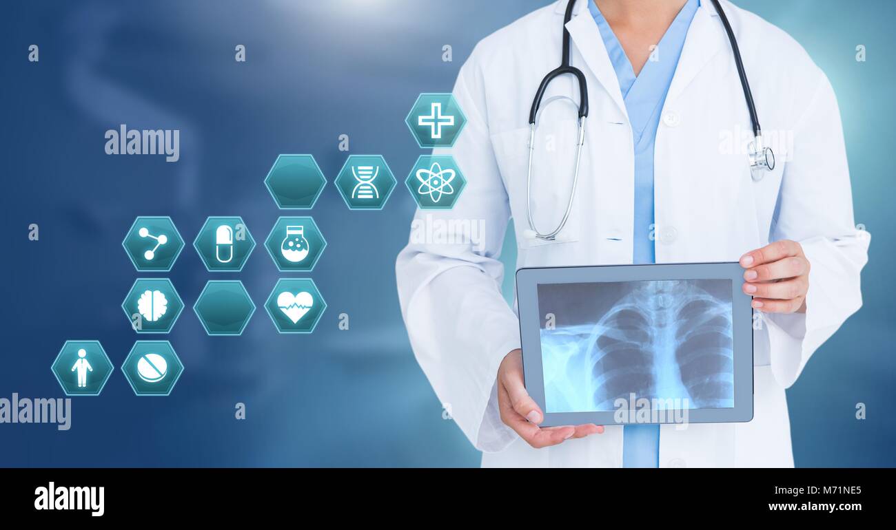 Doctor holding tablet with medical interface hexagon icons and X-Ray ...