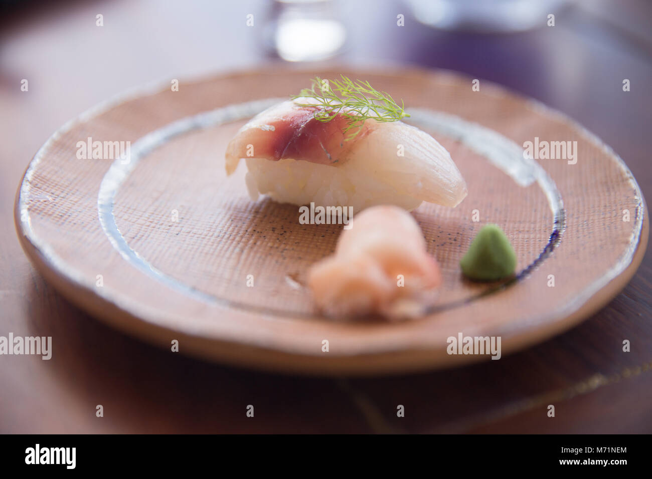 Yellow Tail Nigiri Sushi with Dill Sprig Stock Photo - Alamy