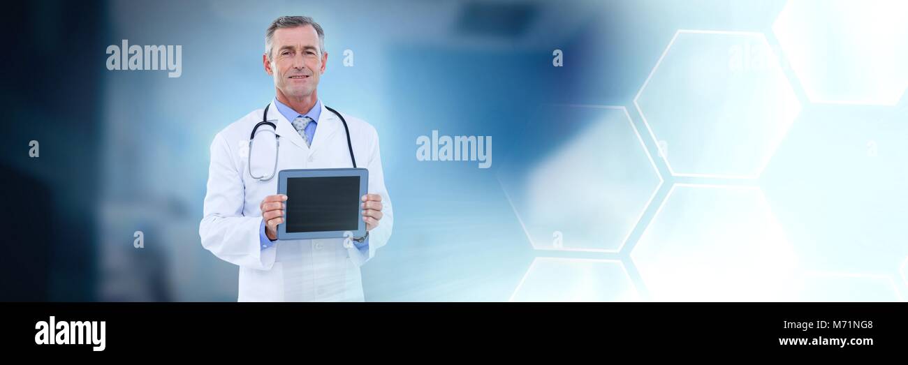 Male doctor holding tablet Stock Photo - Alamy