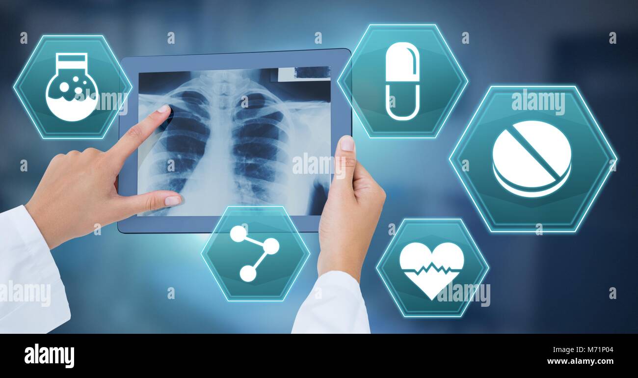 Doctor holding tablet with medical interface hexagon icons and x-ray ...