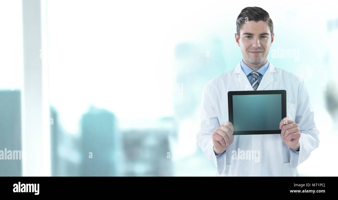 Male doctor holding tablet Stock Photo - Alamy