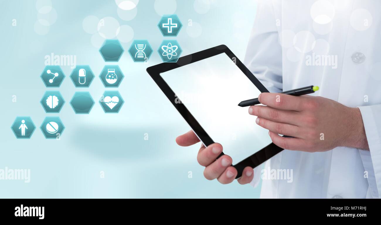 Doctor holding tablet with medical interface hexagon icons Stock Photo ...