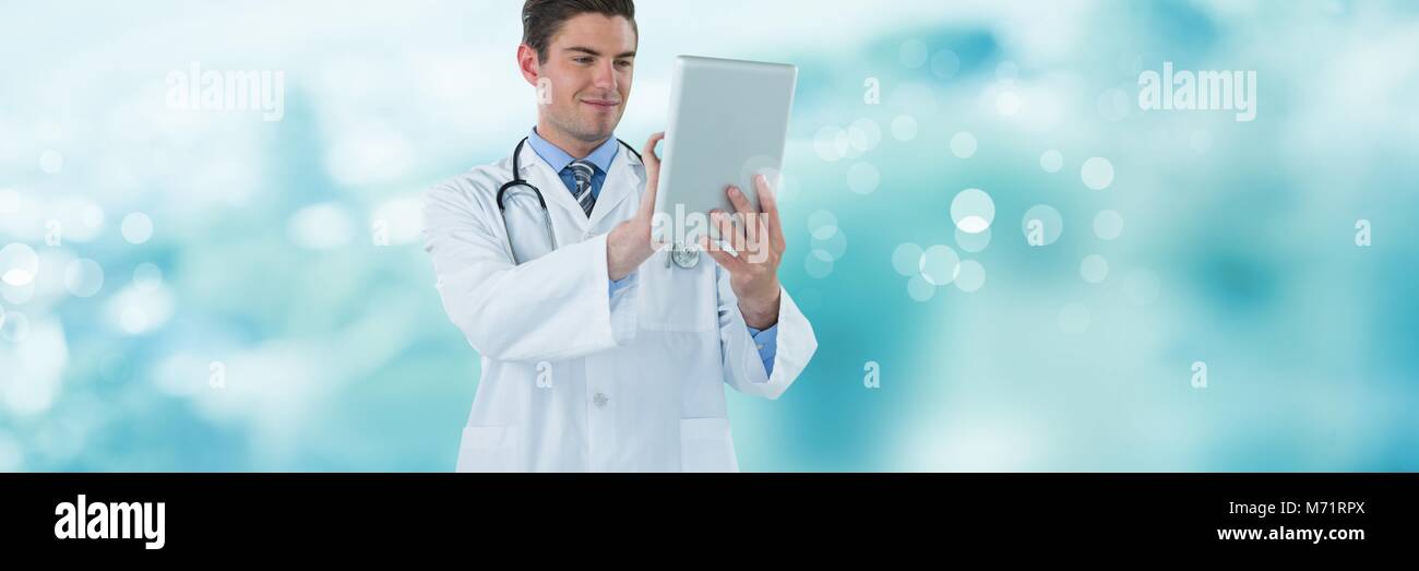 Male doctor holding tablet Stock Photo - Alamy