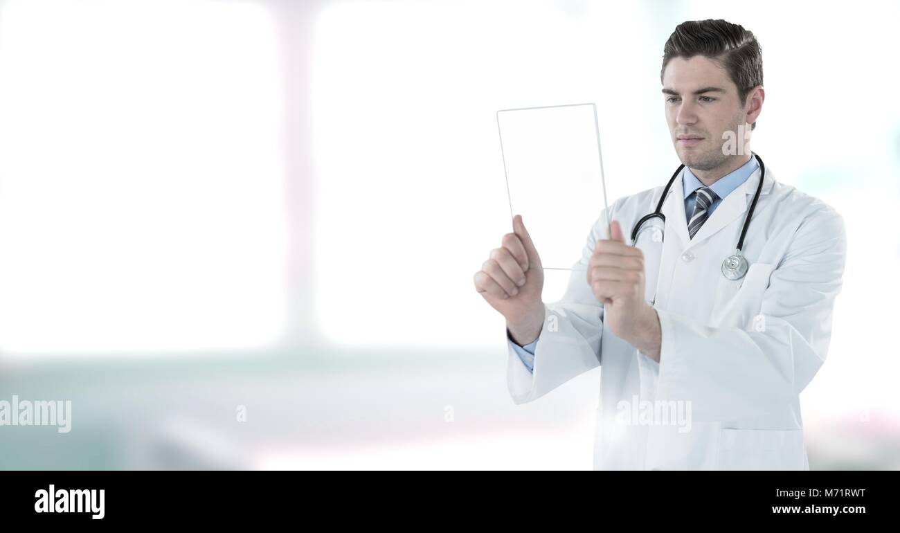 Male doctor holding tablet Stock Photo - Alamy