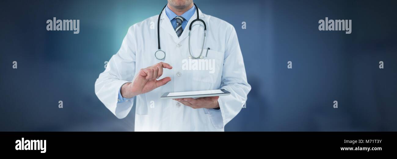 Male doctor holding tablet Stock Photo - Alamy