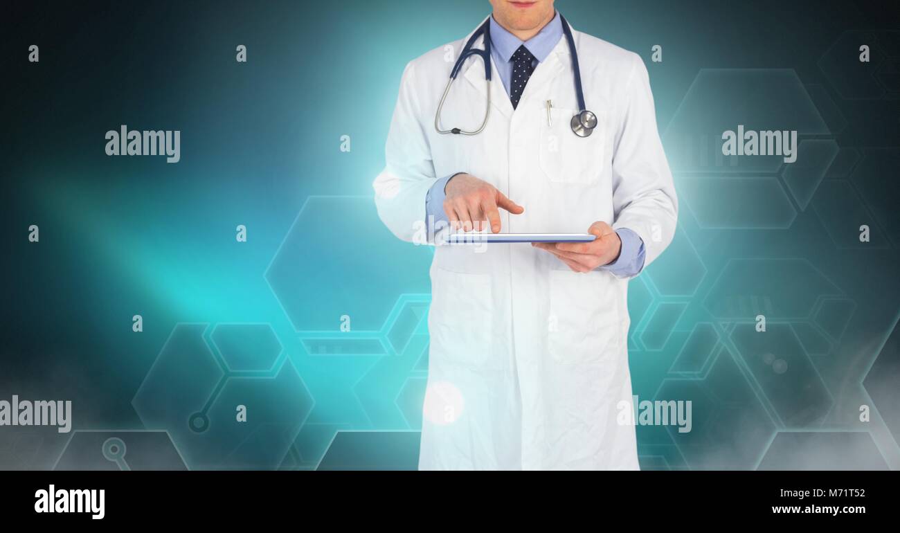 Male doctor holding tablet Stock Photo - Alamy