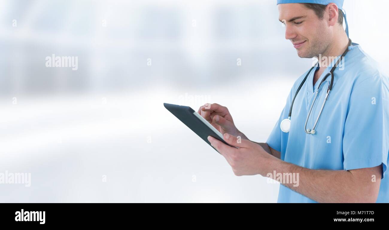 Male doctor holding tablet Stock Photo - Alamy