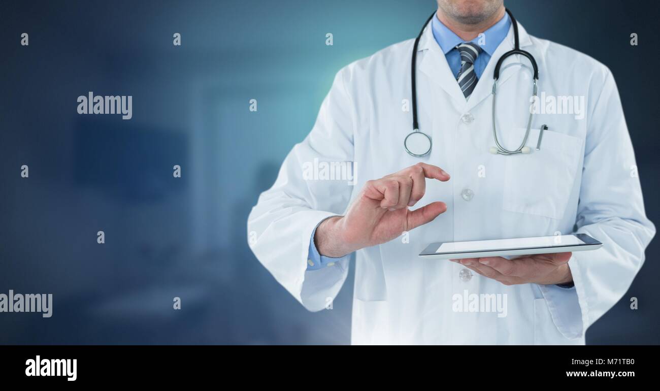 Male doctor holding tablet Stock Photo - Alamy