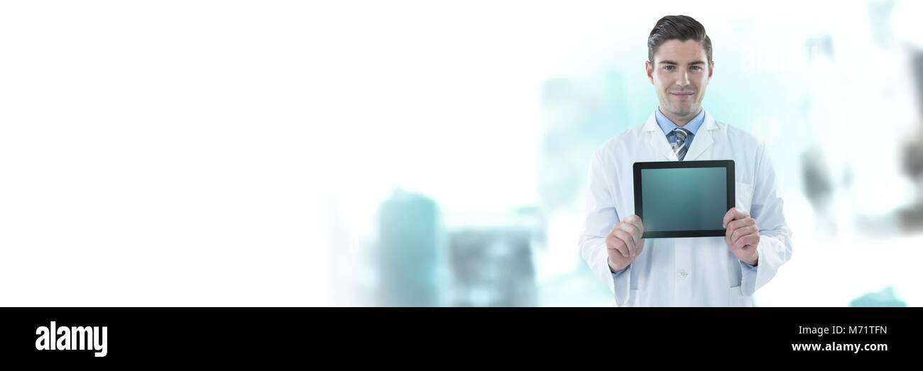 Male doctor holding tablet Stock Photo - Alamy