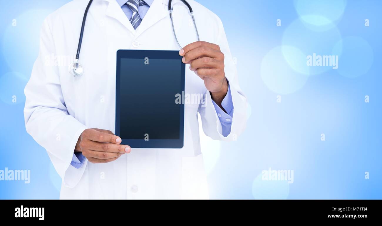 Male doctor holding tablet Stock Photo - Alamy
