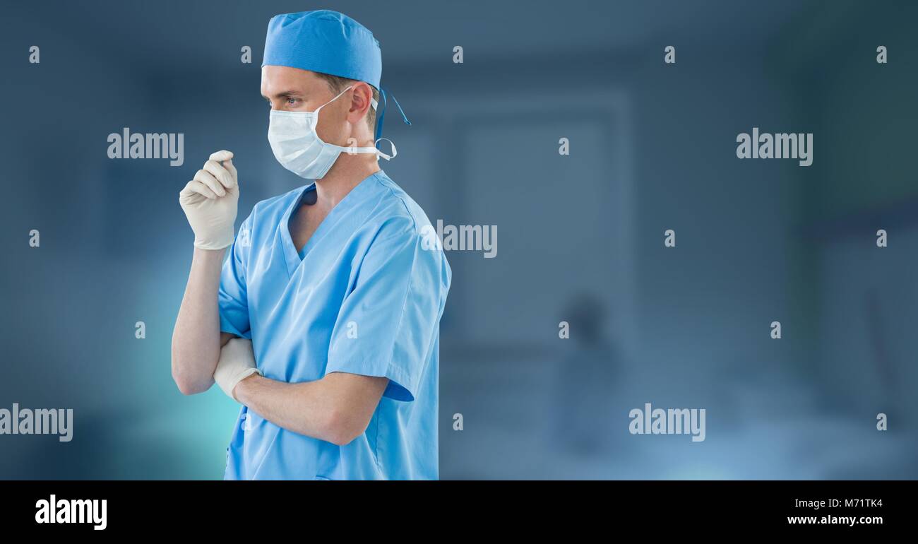 Male doctor thinking and wearing surgical mask Stock Photo - Alamy