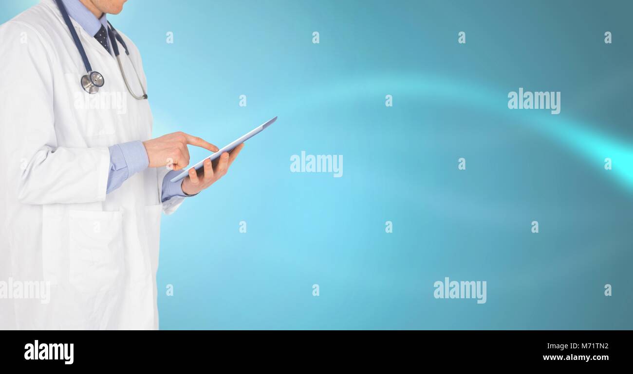 Male doctor holding tablet Stock Photo - Alamy