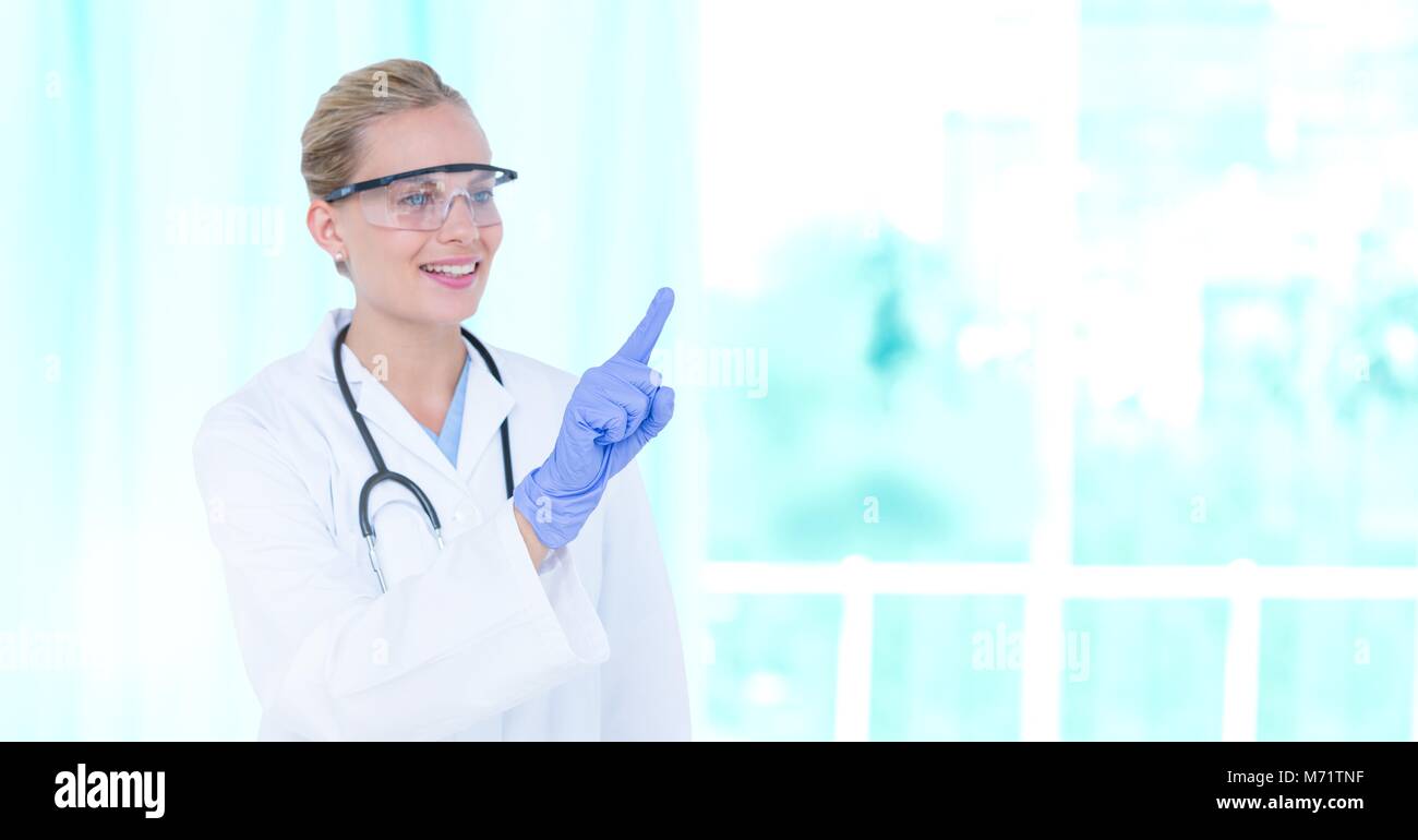 Female doctor interacting with air touch Stock Photo - Alamy