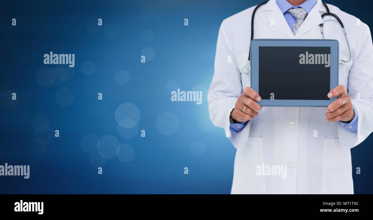 Male doctor holding tablet Stock Photo - Alamy