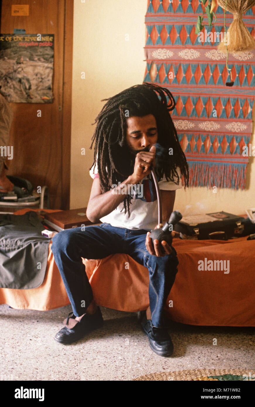 Friends of Augustus Pablo smoking the marijuana pipe, Kingston, Jamaica ...