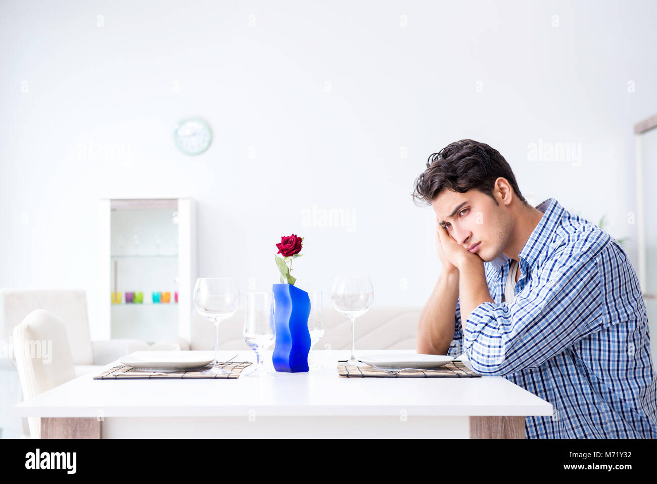 Man alone preparing for romantic date with his sweetheart Stock Photo ...