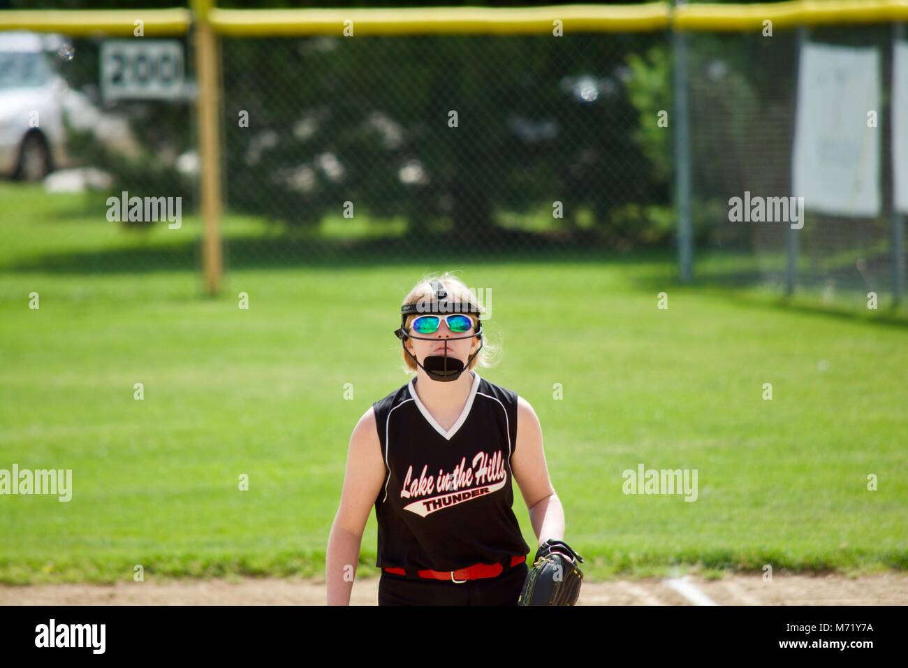 Fastpitch softball player is ready to catch the ball. This photo was ...