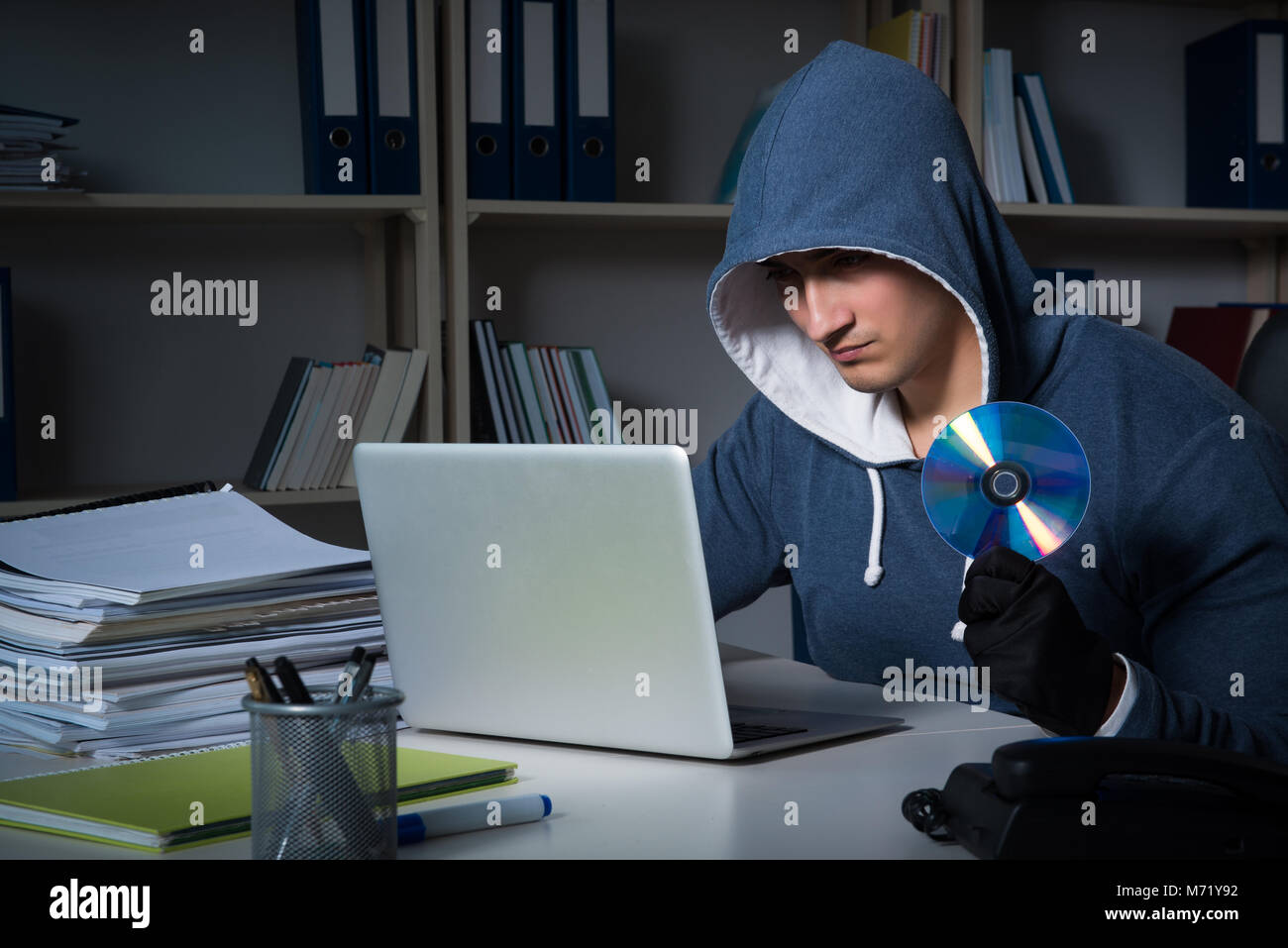 Young hacker hacking into computer at night Stock Photo - Alamy