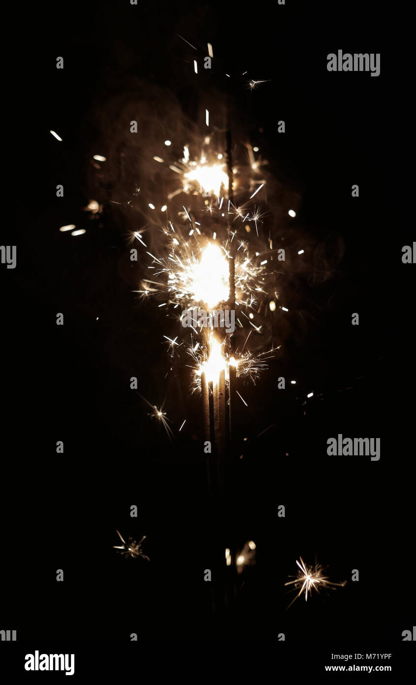 A bundled set of firework sparklers burning all at once Stock Photo - Alamy