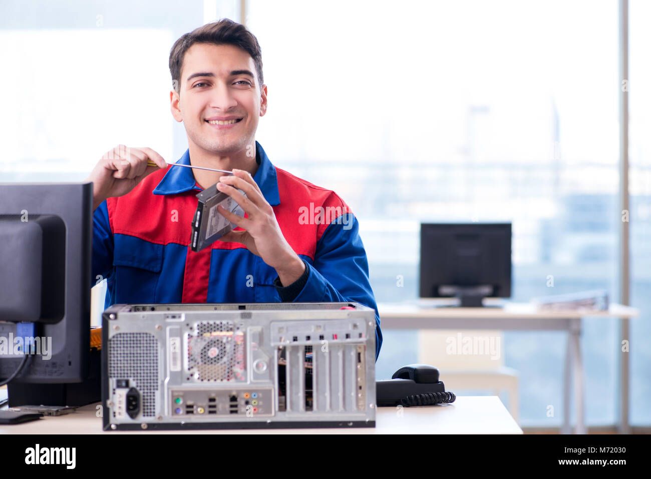 Data restoration specialist repairing corrupt hard drive Stock Photo ...