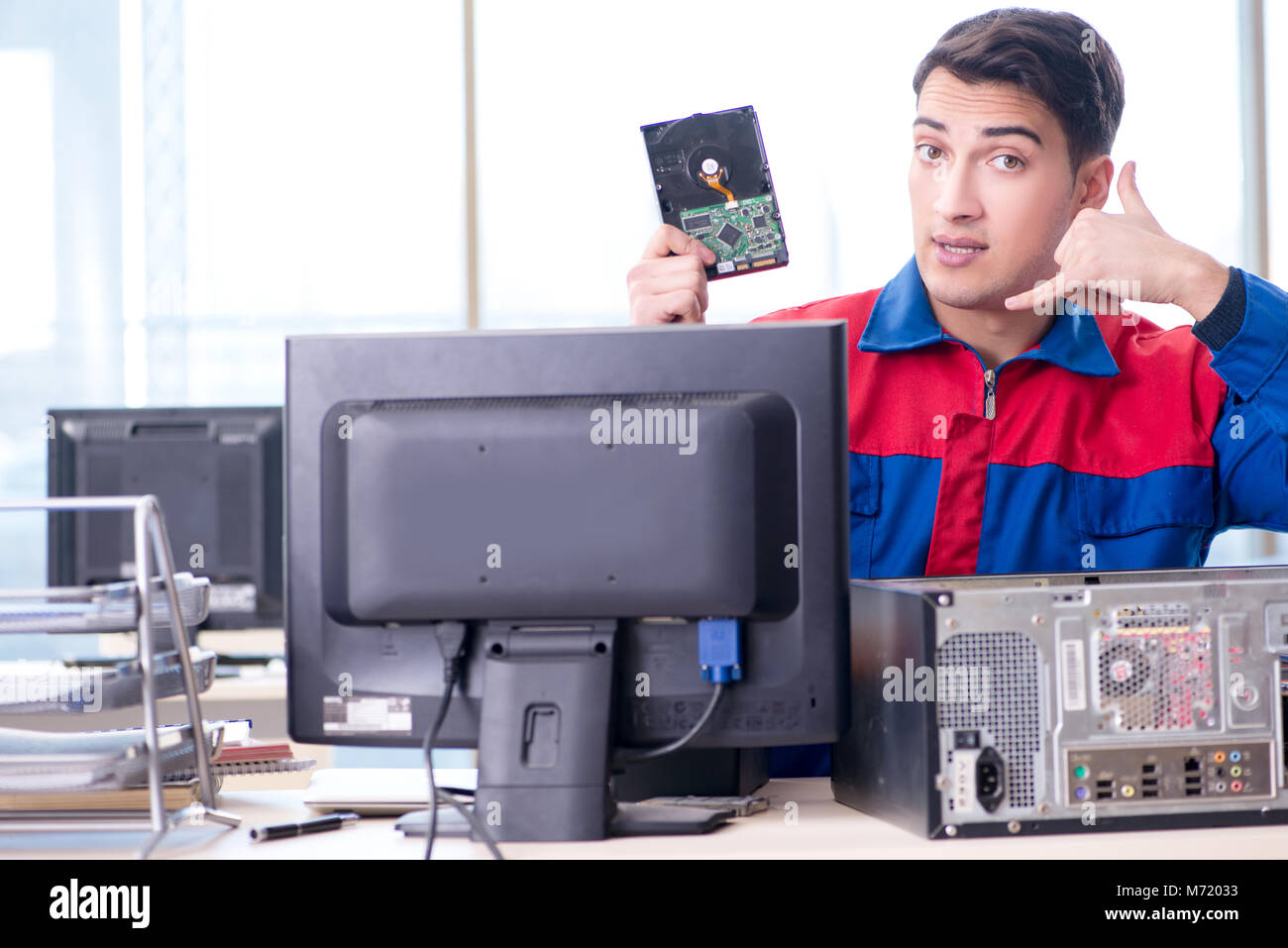 Data restoration specialist repairing corrupt hard drive Stock Photo ...
