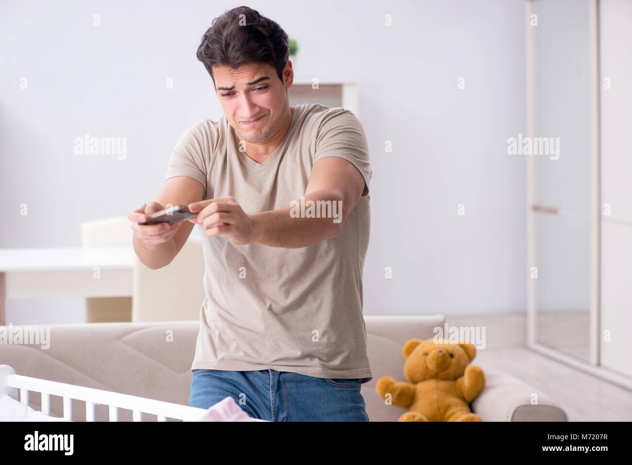 Stressed father crying baby hi-res stock photography and images - Alamy