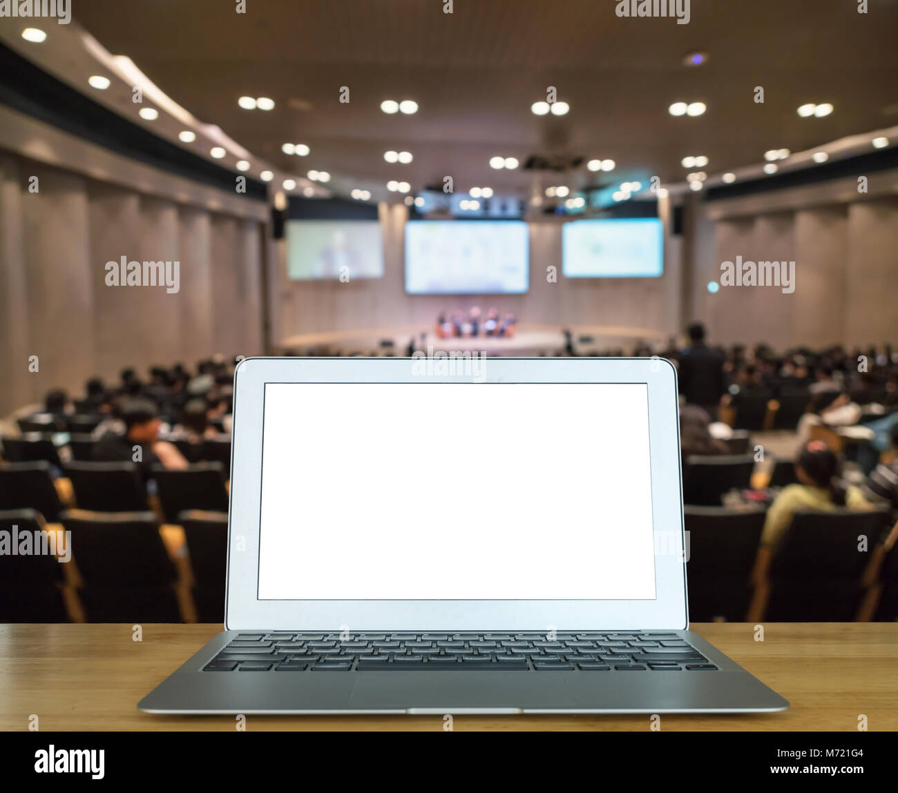 Computer laptop on the wood table over Abstract blurred photo of ...